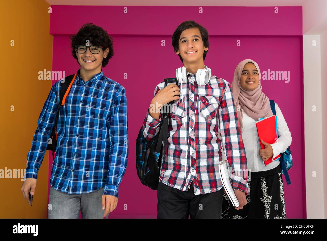 A group of Arab teenagers, a student team walking forward into the ...