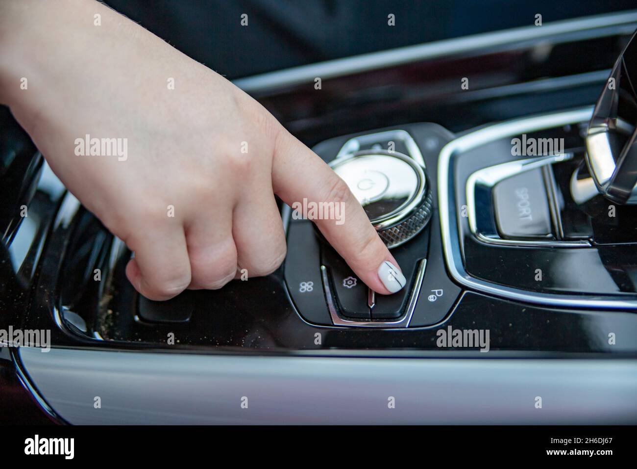 hand push button on center console of modern car Stock Photo - Alamy