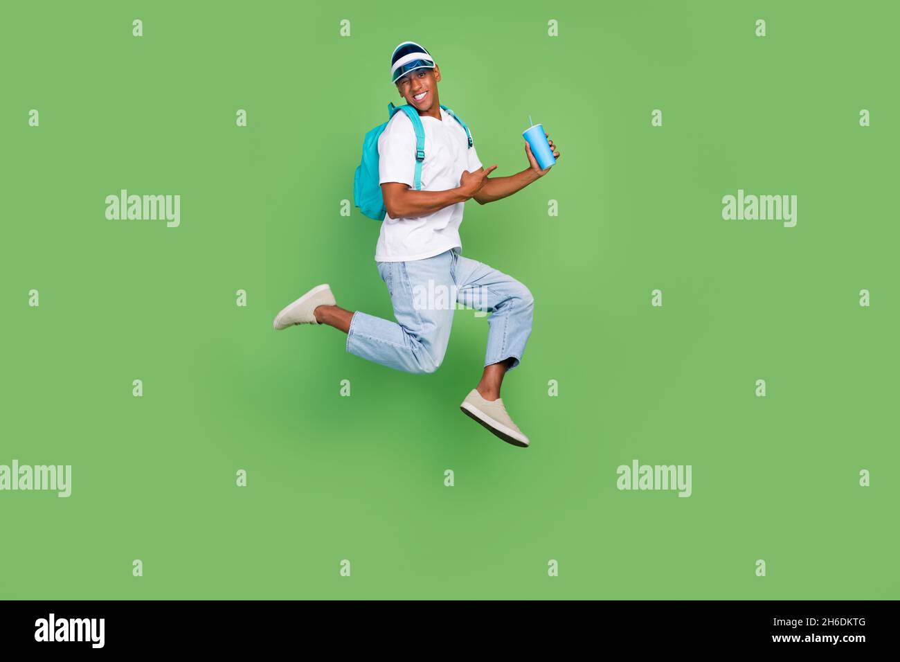 Full body profile photo of funny young brunet guy drink lemonade run ...