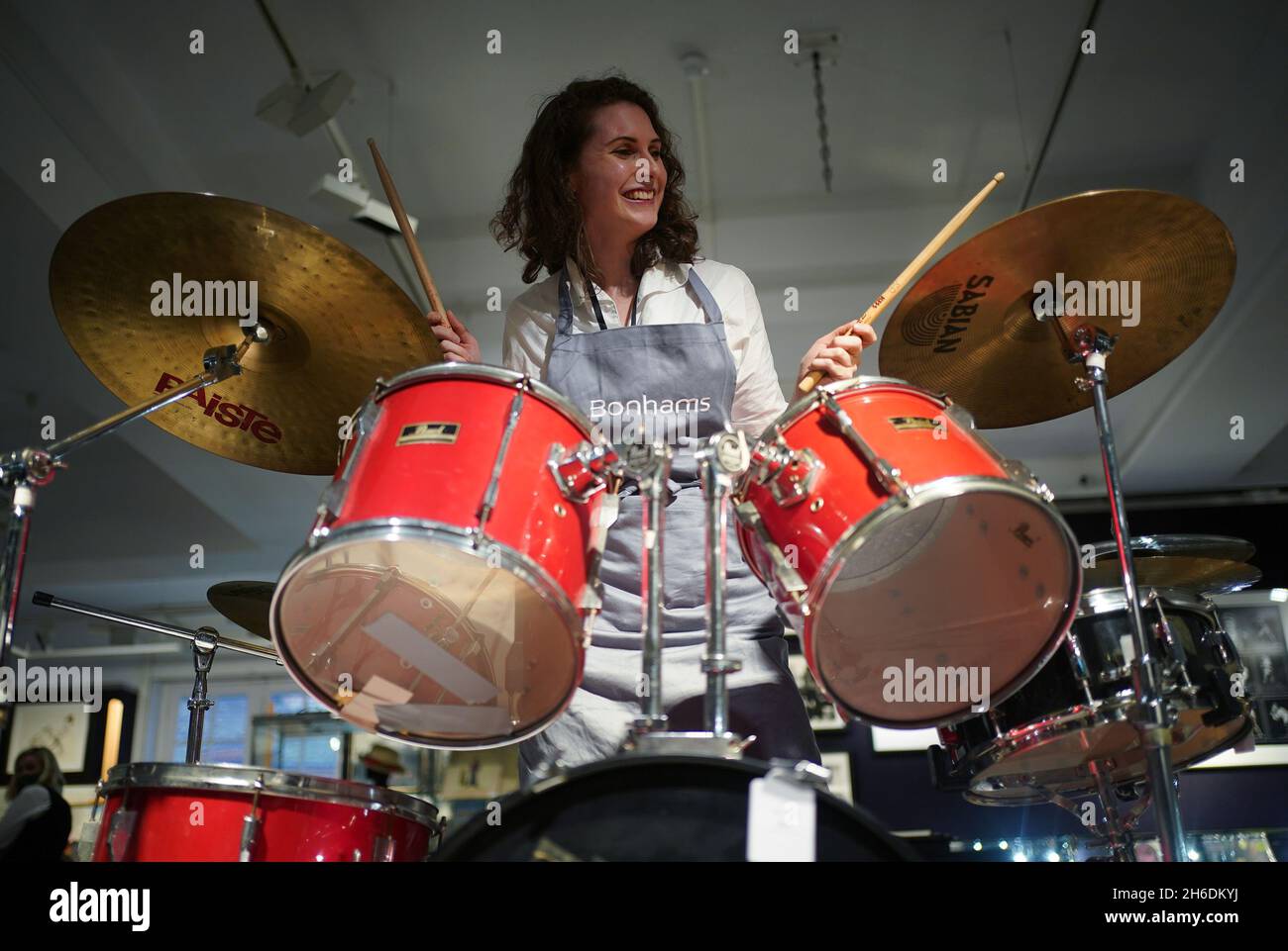 A Bonhams member of staff poses with a complete Pearl Export Series ...