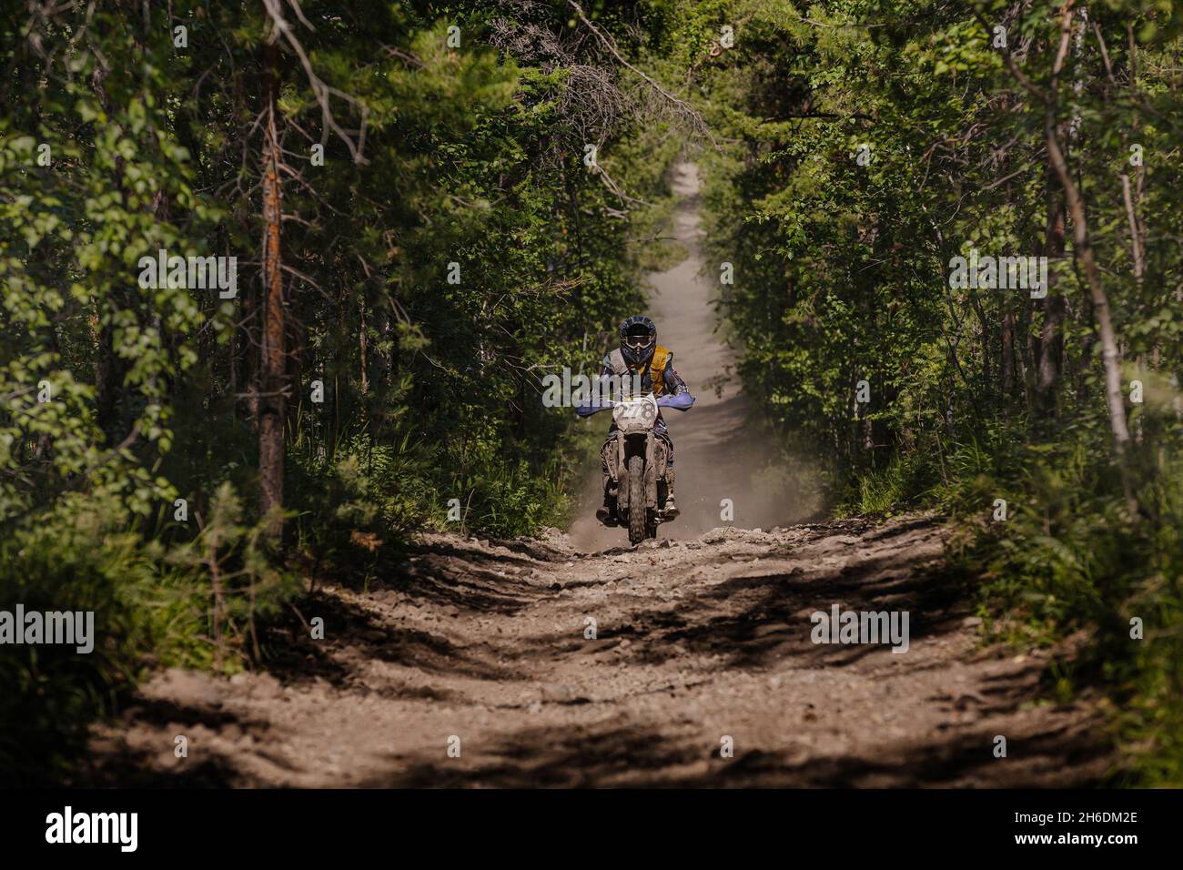 male enduro motorcycle racer riding on forest Stock Photo - Alamy