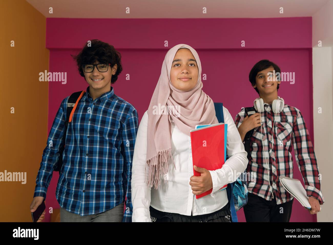 A group of Arab teenagers, a student team walking forward into the ...
