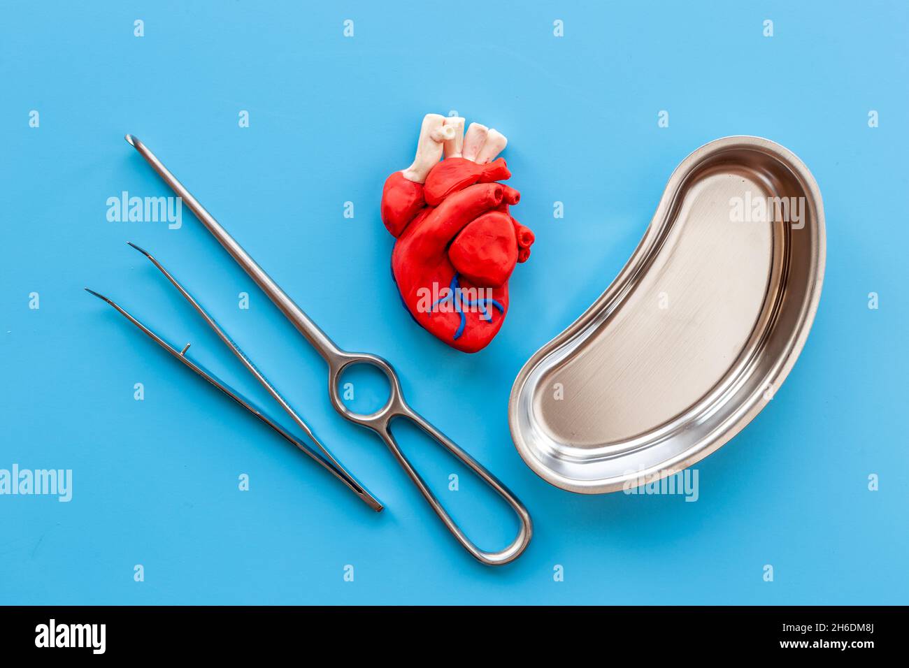 Surgical instruments and heart model. Heart surgery concept Stock Photo ...