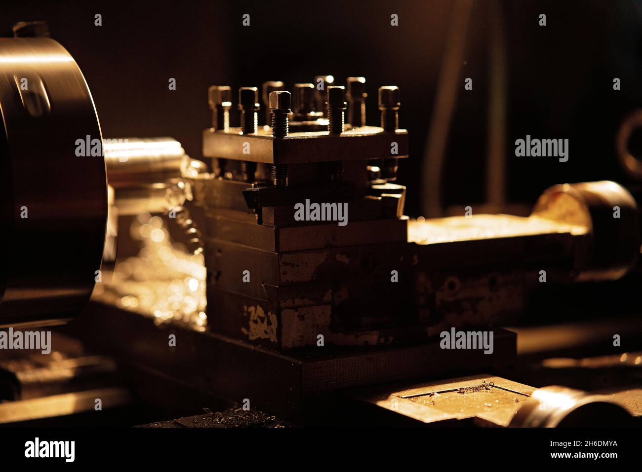 Close up of industrial machines indoors in metal workshop at night ...