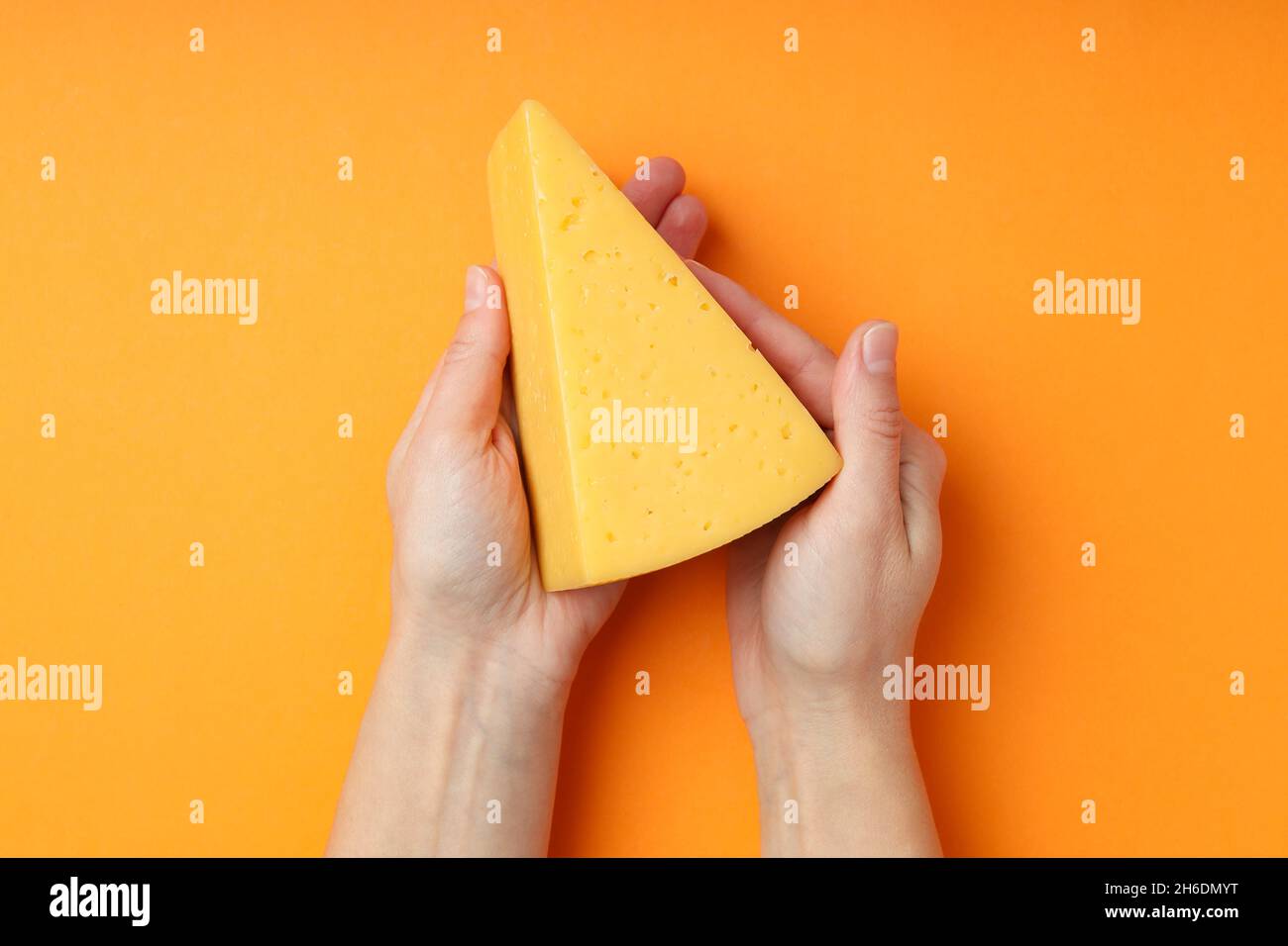 Concept of cooking eating with hard cheese on orange background Stock ...
