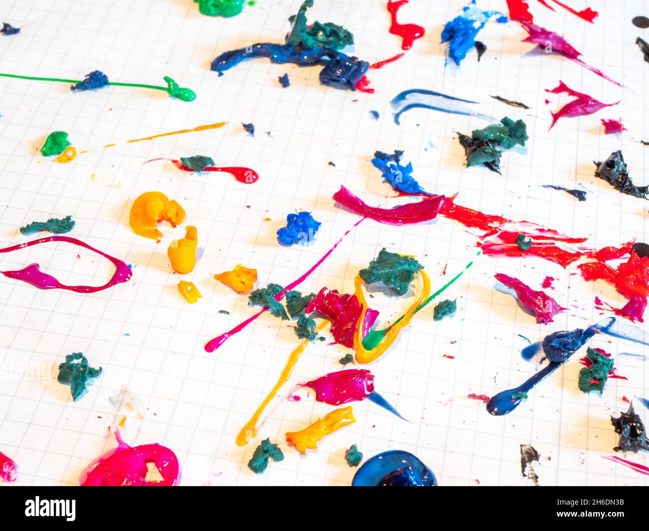 Splash of colorful paint isolated on white paper Stock Photo - Alamy