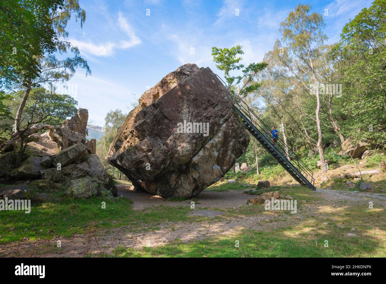 Bowder Stone, view in summer of a man climbing the staircase fixed to ...