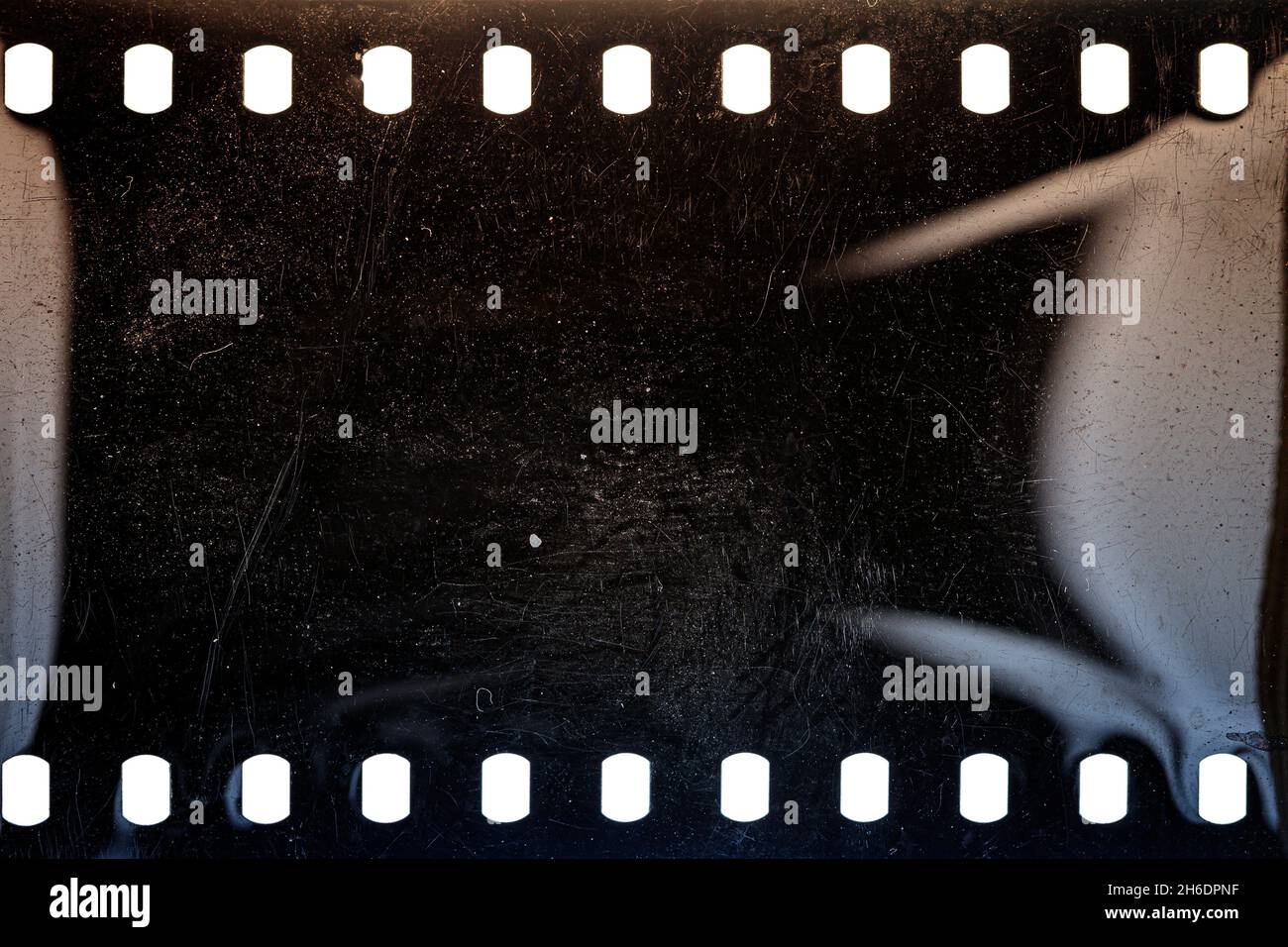 Dusty and grungy 35mm film texture or surface. Perforated camera film ...