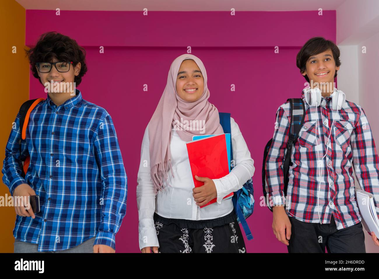 A group of Arab teenagers, a student team walking forward into the ...