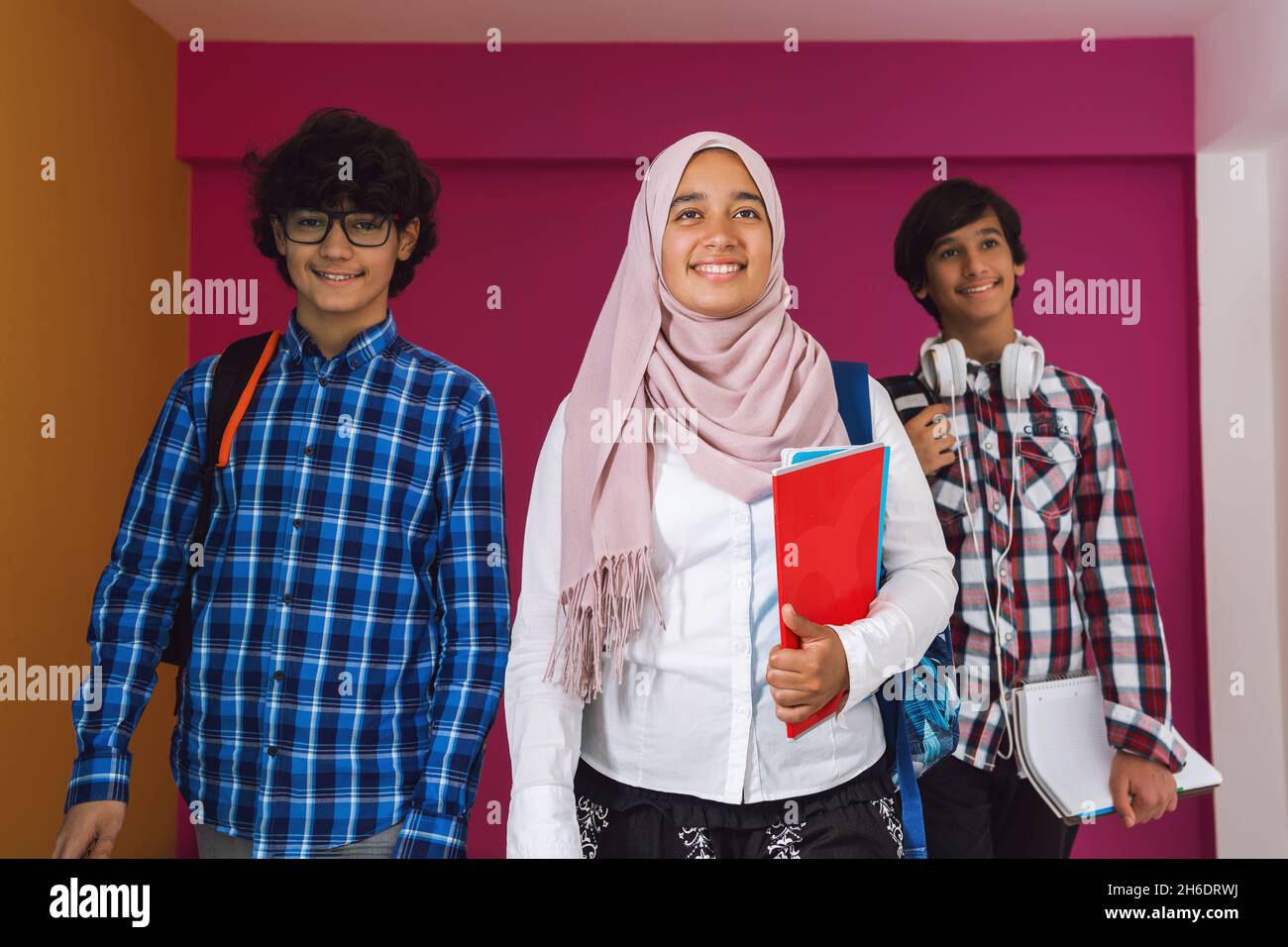 A group of Arab teenagers, a student team walking forward into the ...