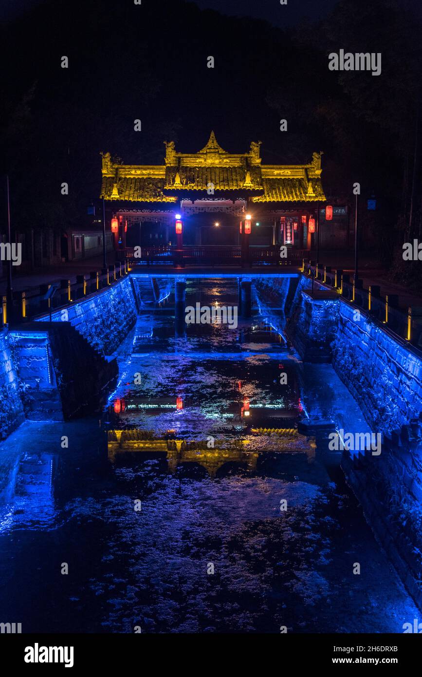 Night view of the ancient Chinese gate at Qintai Road historic district ...
