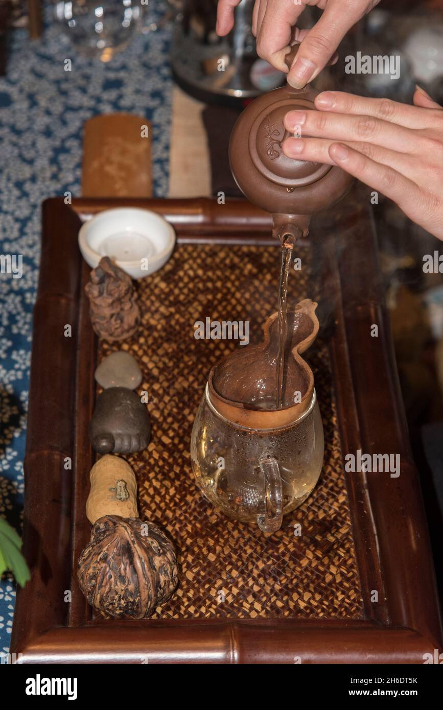 Chinese Tea Ceremony. Male server prepares the traditional tea ...