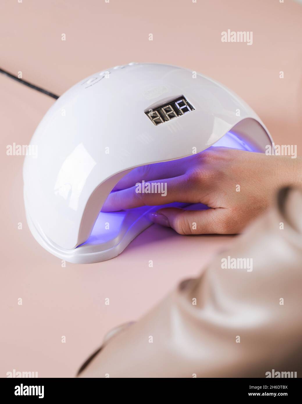 Shellac coated manicure. Drying process of gel polish in an ultraviolet ...