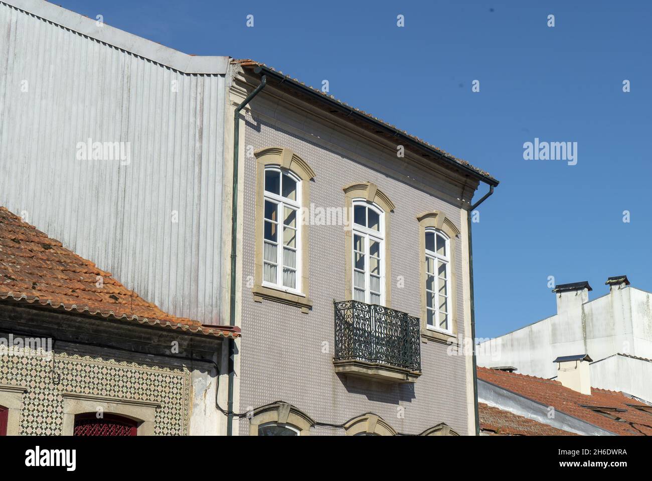 Neoclassical style building with white windows under the blue sky Stock ...