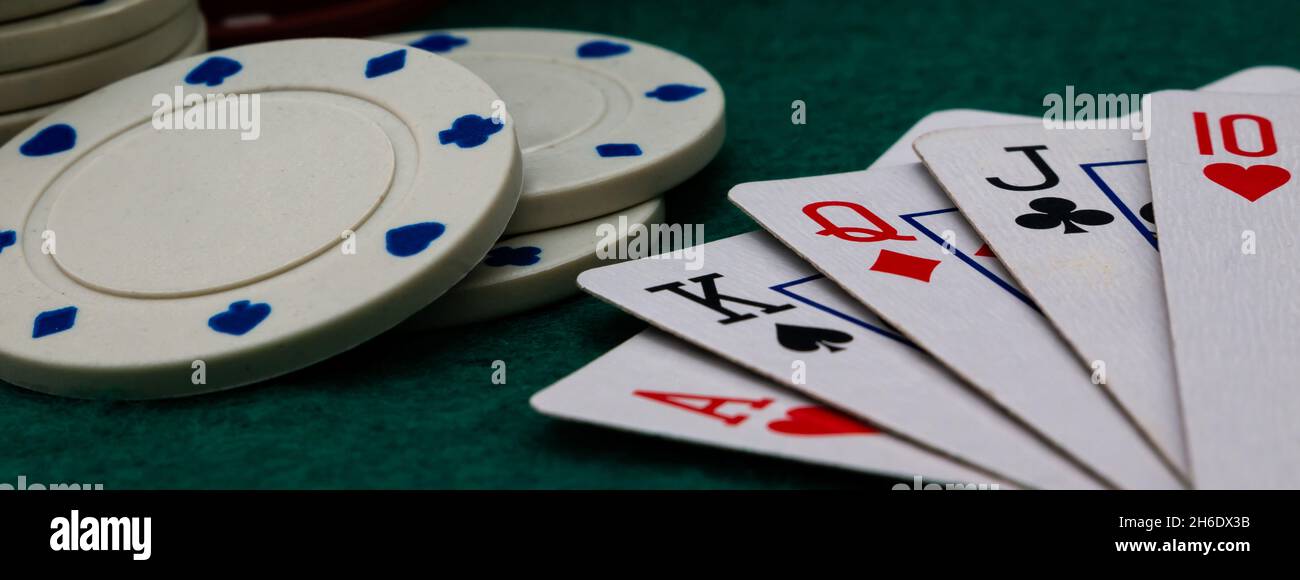 Web Banner Royal straight flush poker cards with stack of poker chips ...