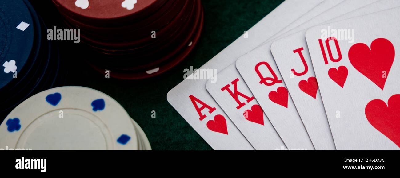 web banner Royal straight flush poker cards with stack of poker chips ...