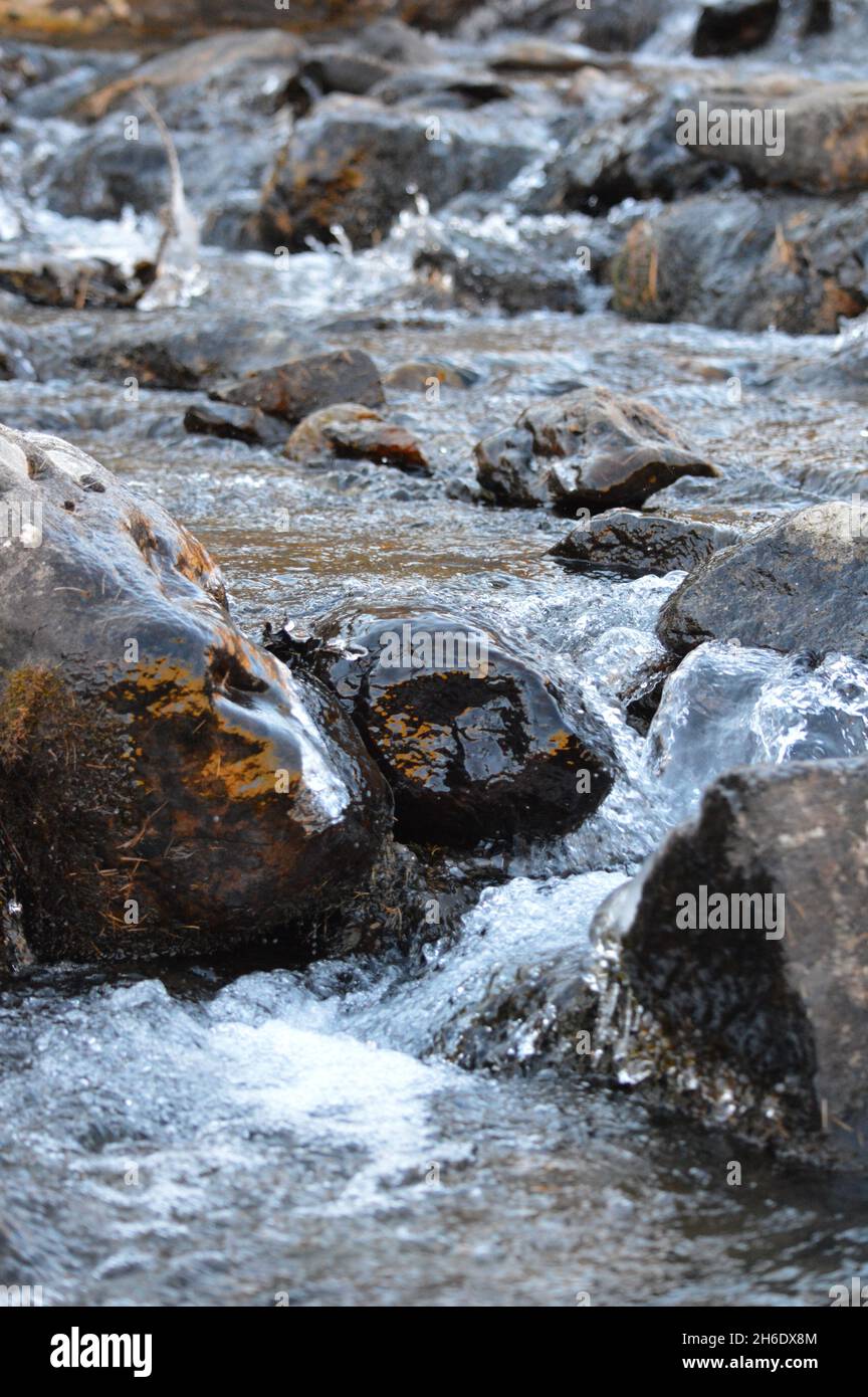 water flowing over stones Stock Photo - Alamy