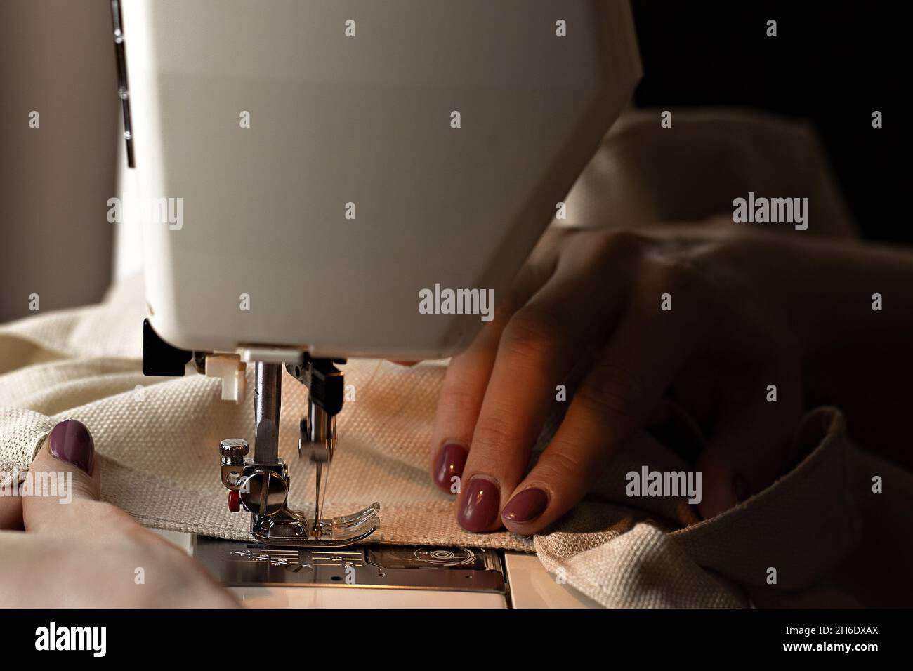 sewing process close-up. lady tailor creates new types of clothing ...