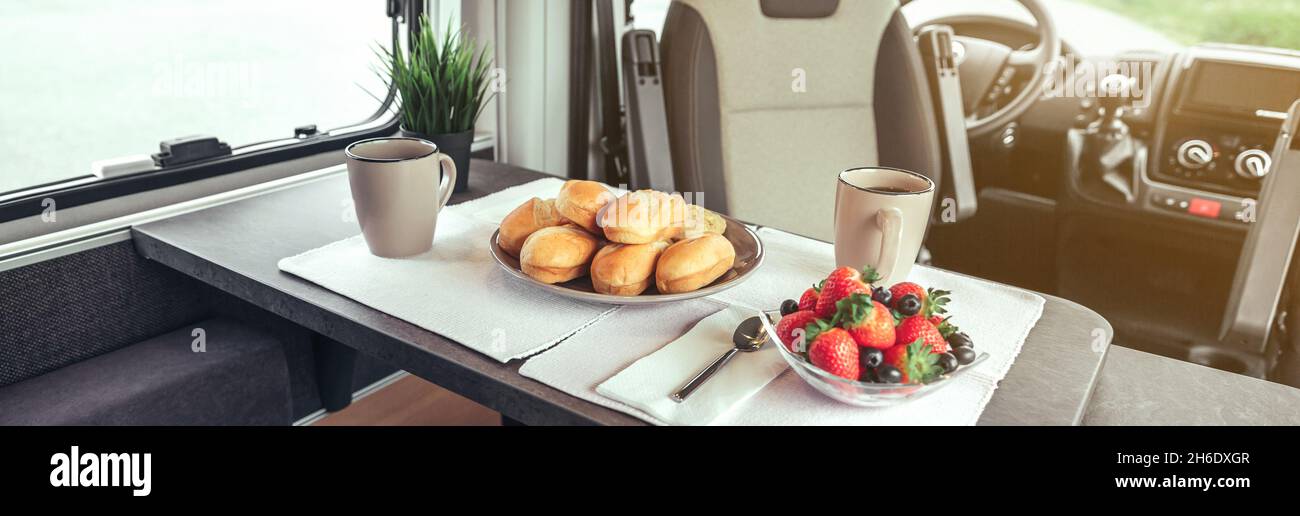 Breakfast on the table in a camper van Stock Photo - Alamy