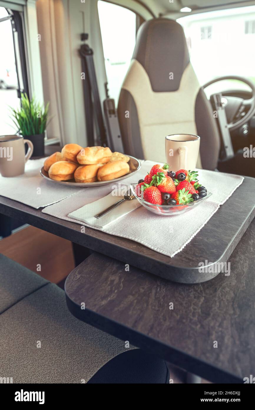Breakfast on the table in a camper van Stock Photo - Alamy