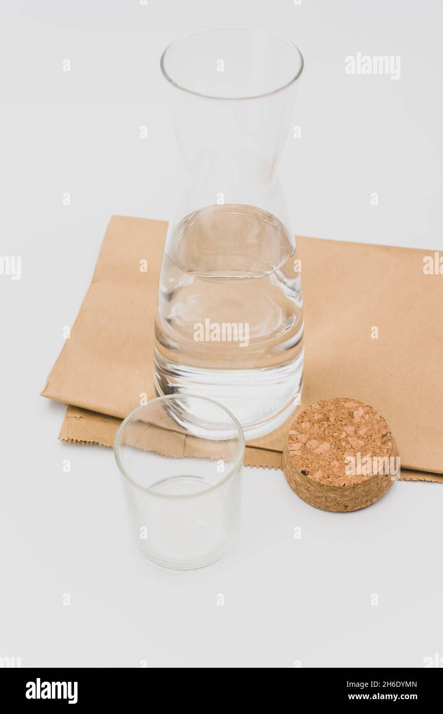 glass carafe with fresh water and cork lid on a white background Stock ...
