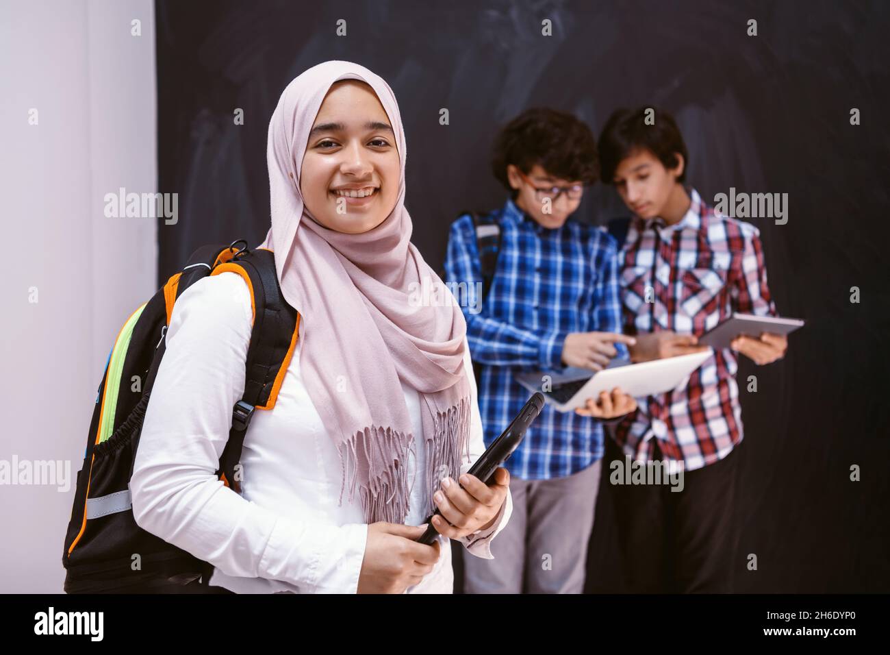 Arabic teenagers team, students group working together on laptop and ...