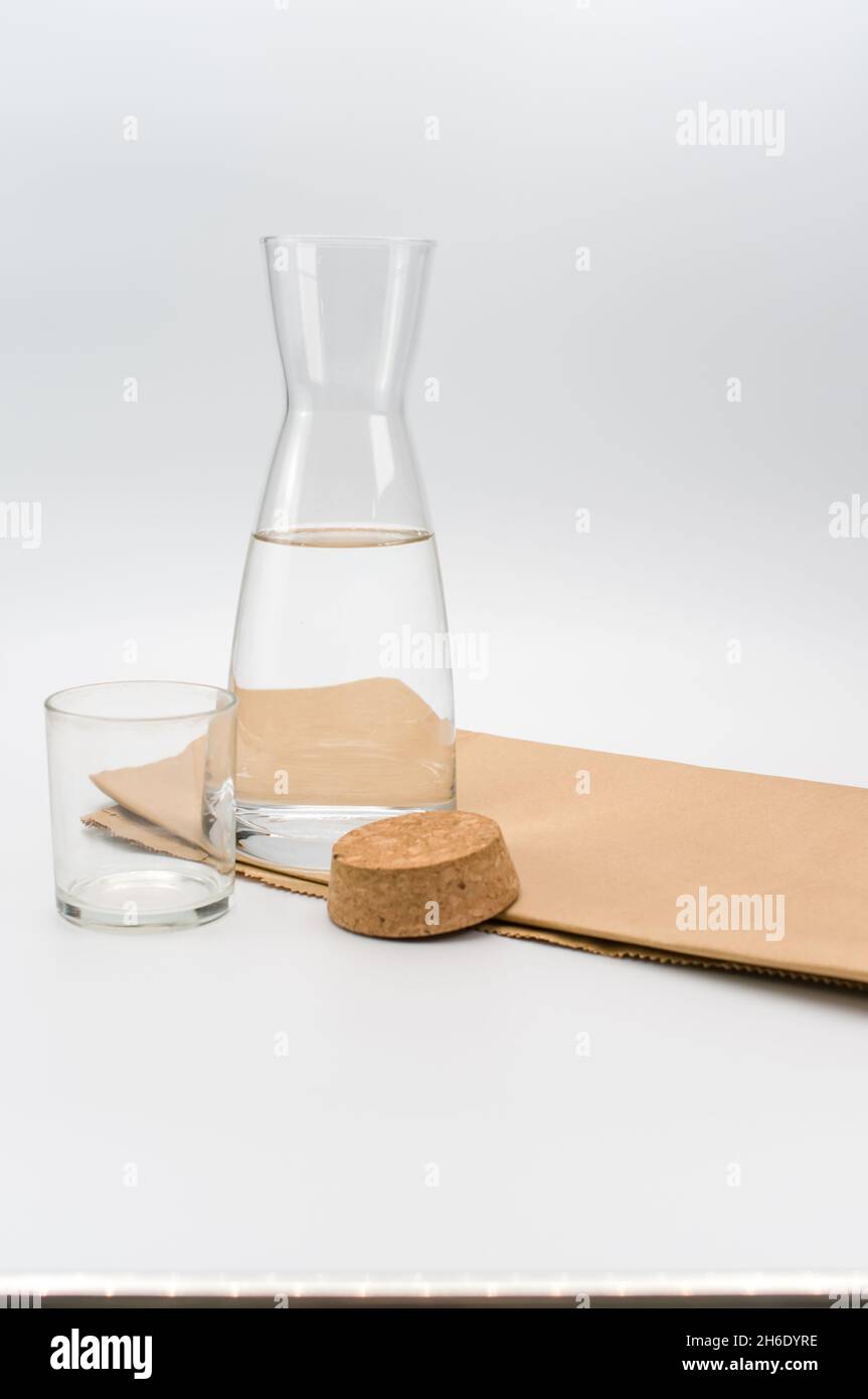 glass carafe with fresh water and cork lid on a white background Stock ...
