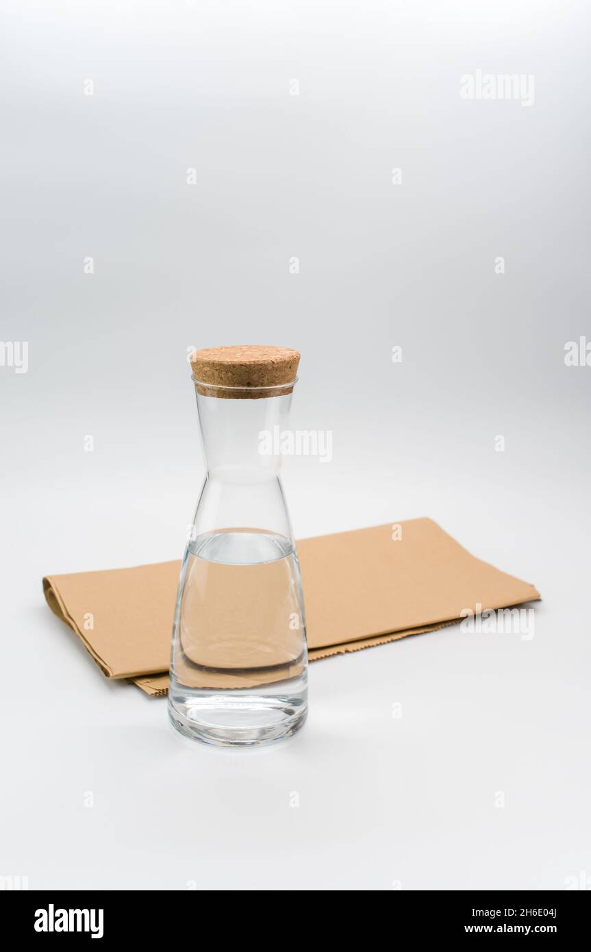glass carafe with fresh water and cork lid on a white background Stock ...