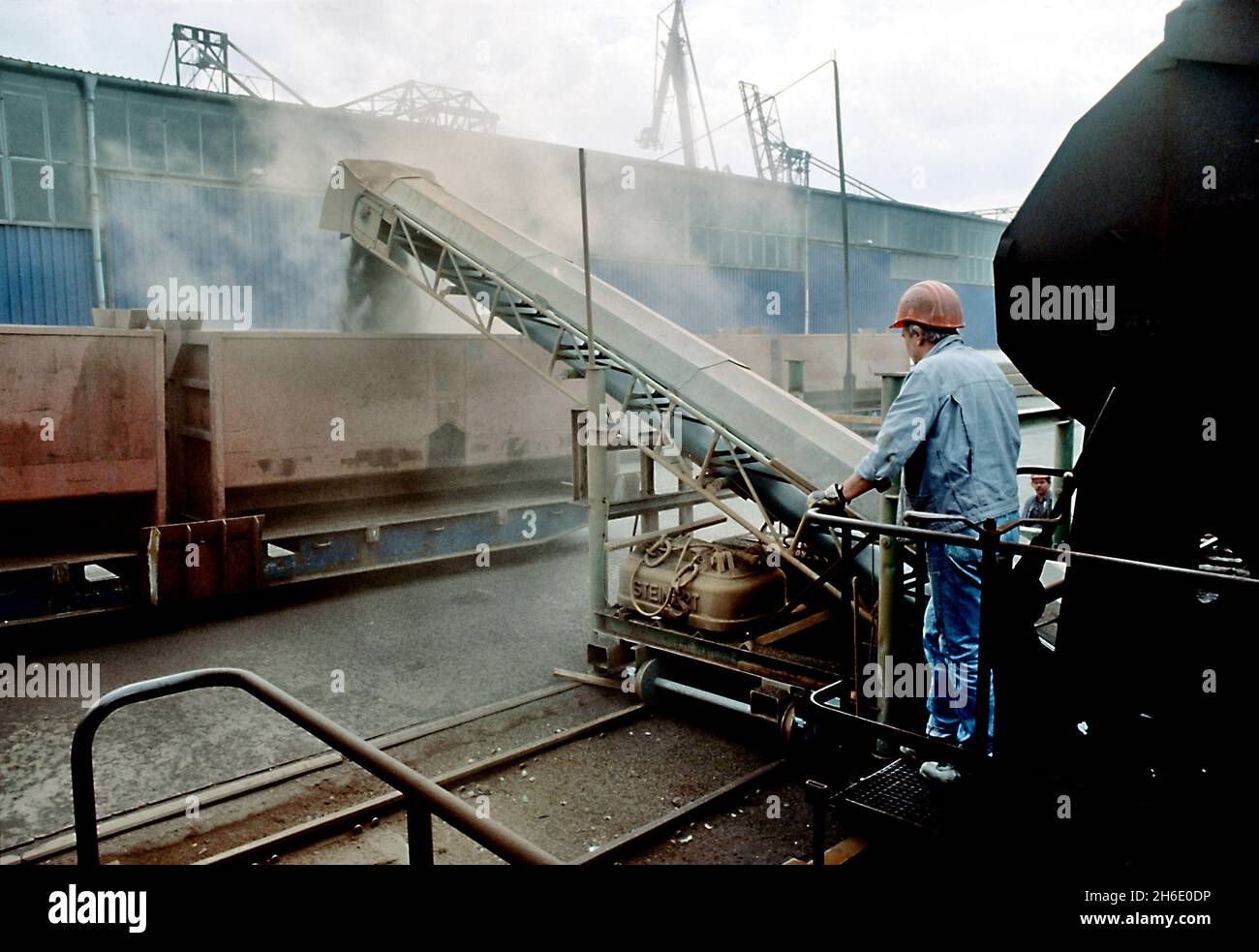 Cinder being transshipped in the Port of Harburg Stock Photo - Alamy