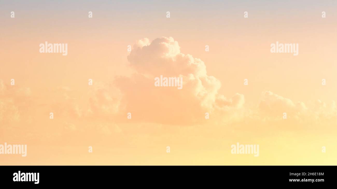 Colorful dramatic clouds lit by a sun against the sunset or sunrise sky ...