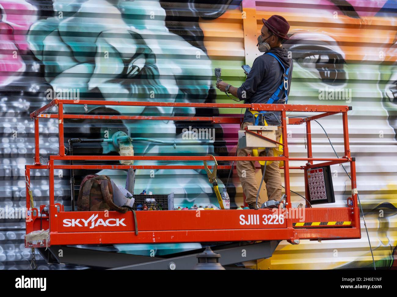 painter touching up mural in downtown Manhattan NYC Stock Photo - Alamy