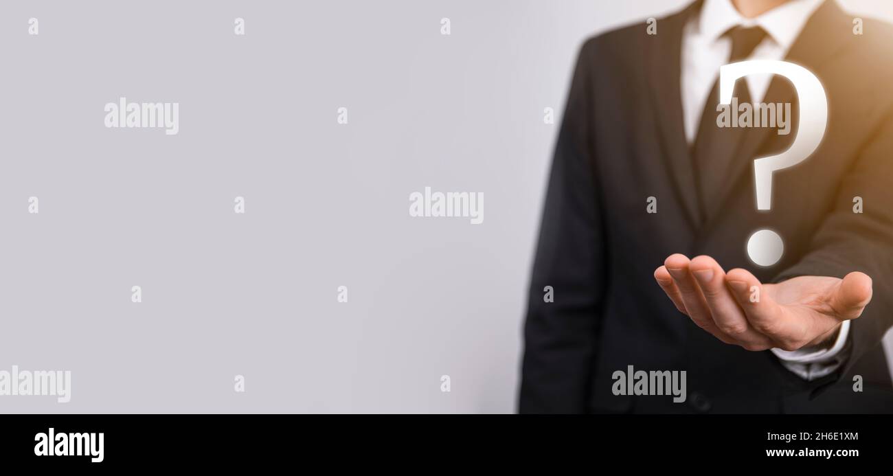 Businessman man hand hold interface question marks sign web. Ask ...