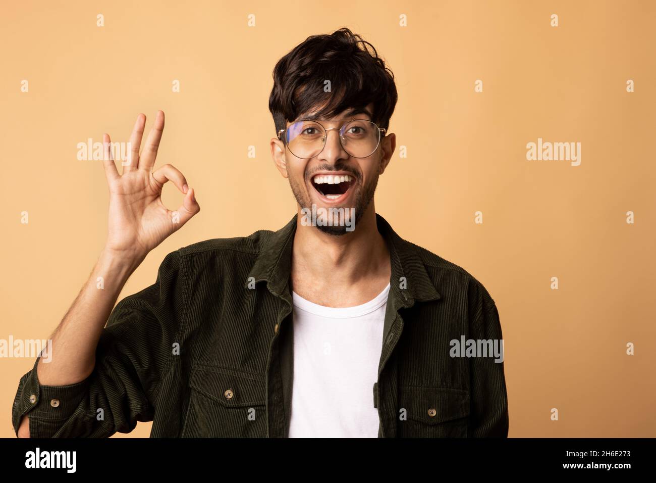 Excited young man gesturing hi-res stock photography and images - Alamy