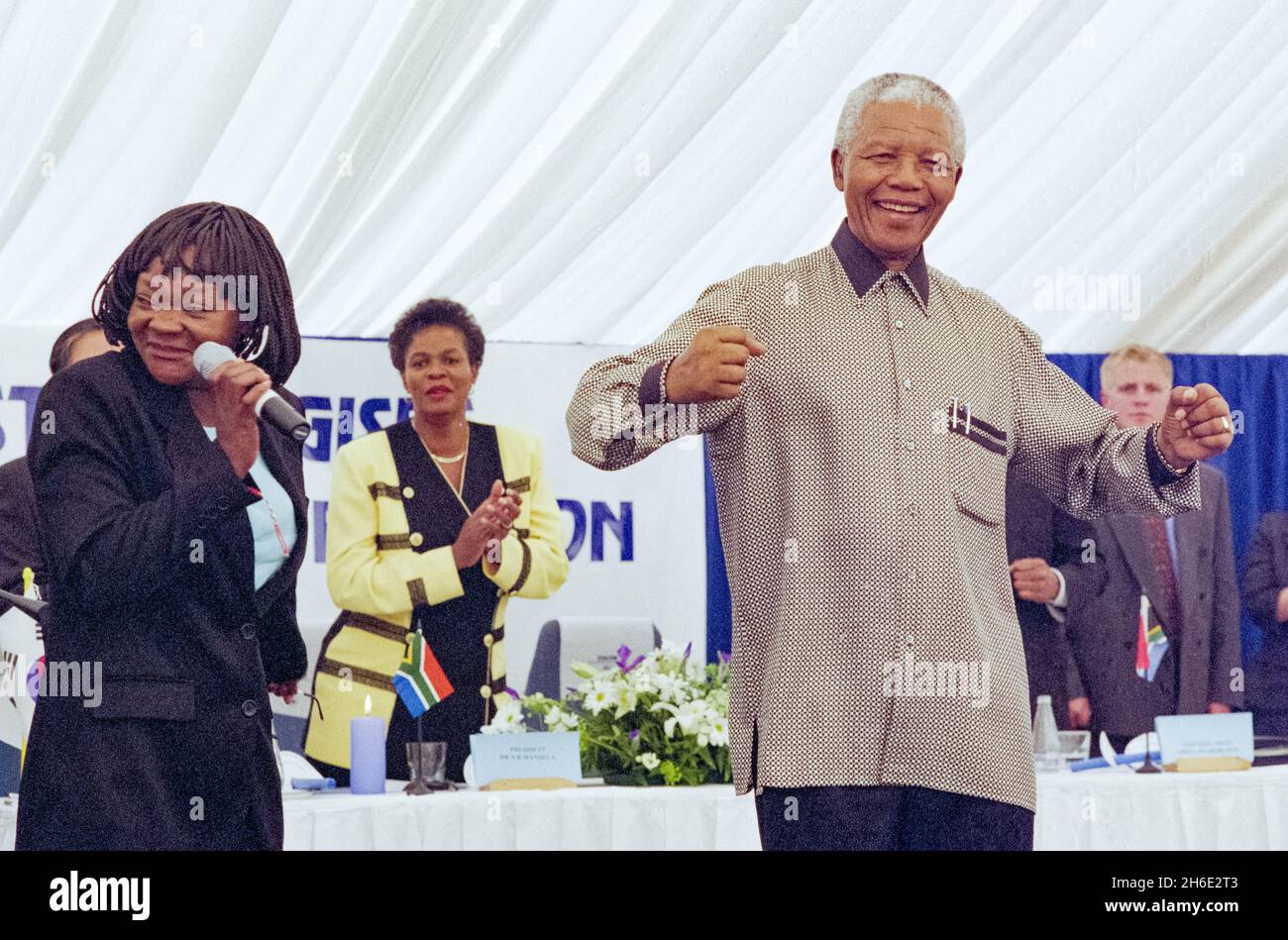 Nelson Mandela dances while Brenda Fassie sings at the launch of a Crime Prevention Campaign ...