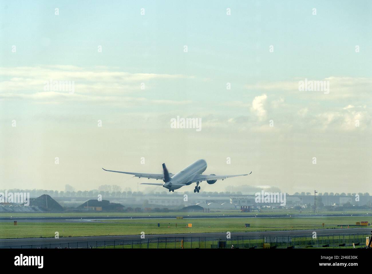 Airplane jet airport take off Stock Photo - Alamy