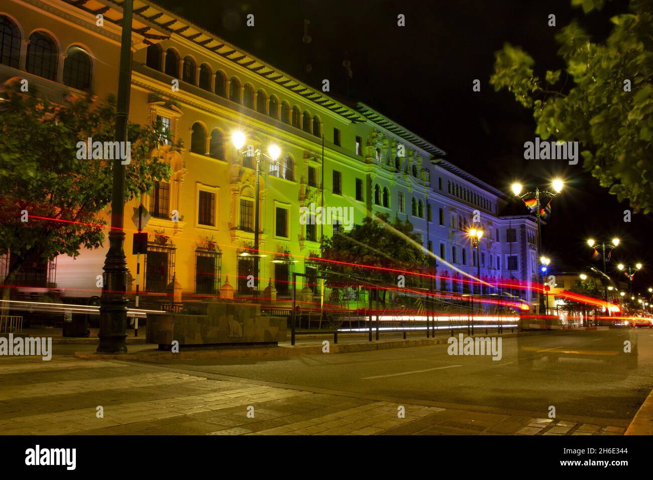 View of the night street with building facades and colorful ...