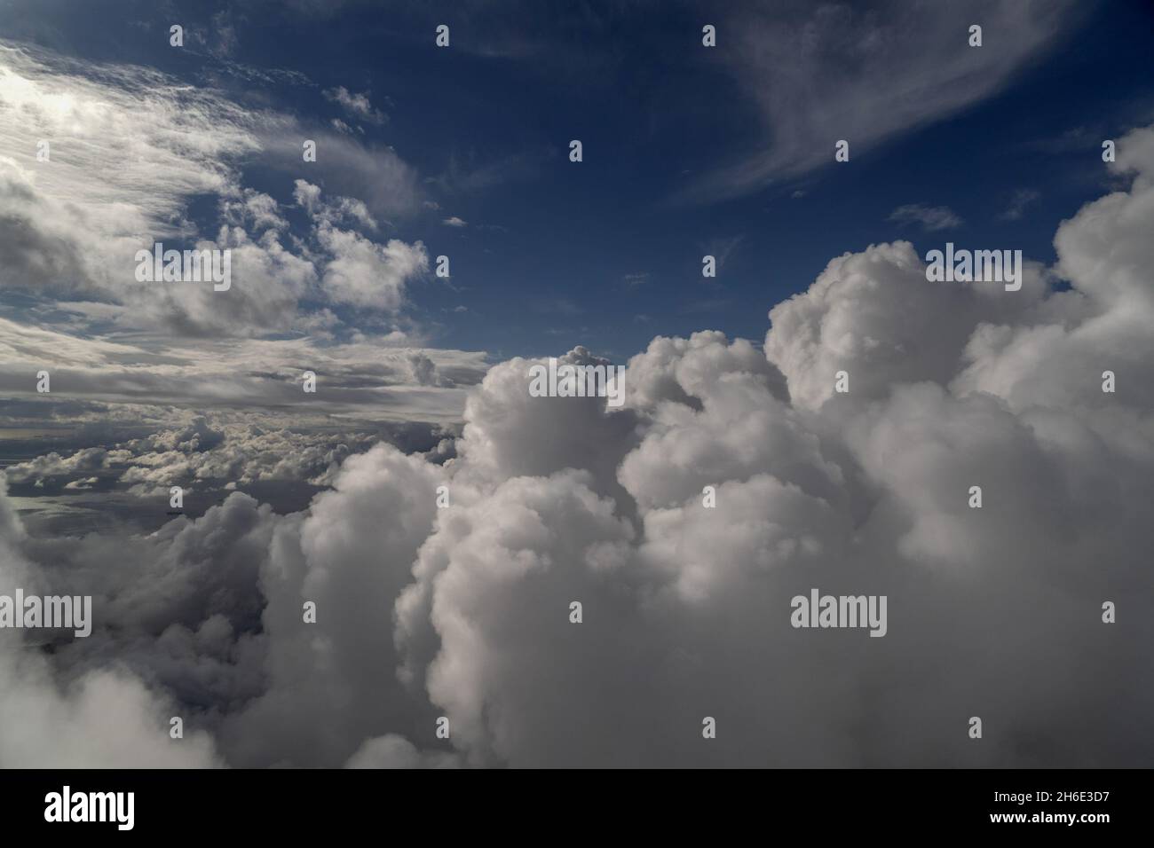 cloudy sky from airplane passenger window while flying Stock Photo - Alamy
