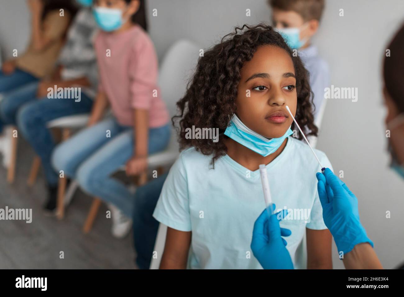 Medical Worker Making PCR Test For Girl, Testing Children Indoor Stock ...