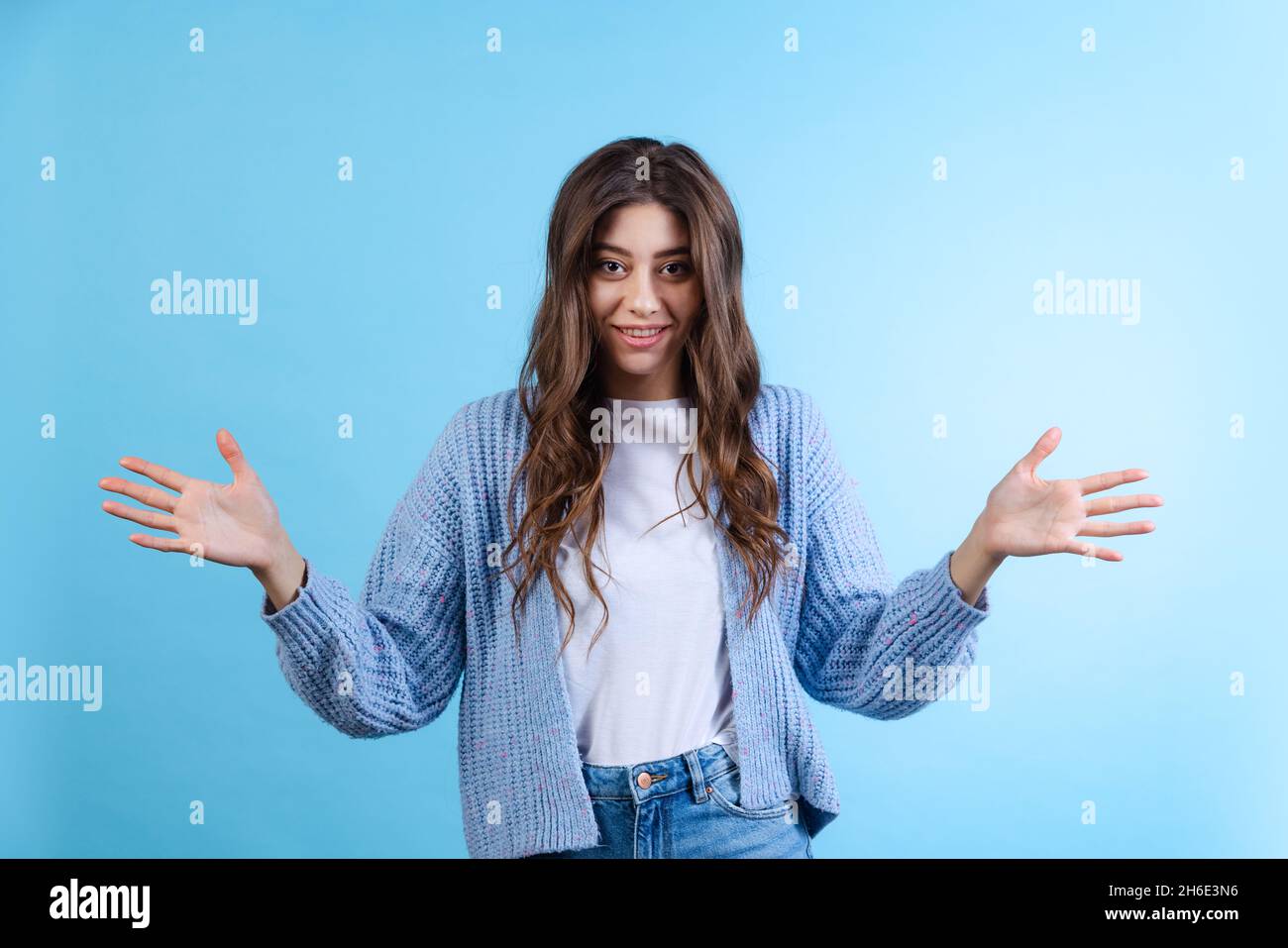 Portrait of young emotional girl posing isolated on navy color studio ...