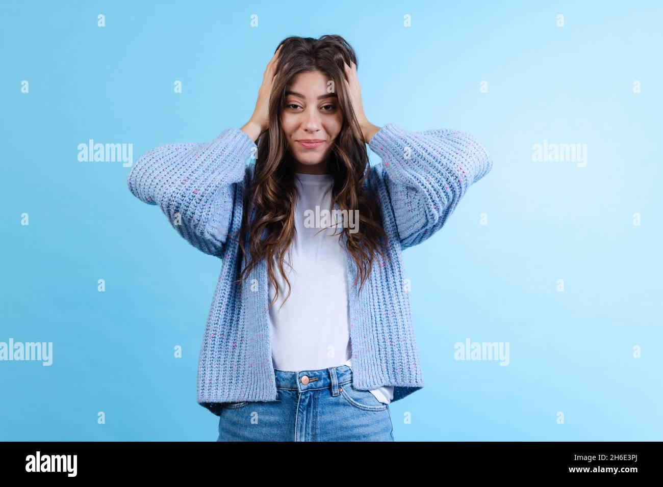 Portrait of young emotional girl posing isolated on navy color studio ...