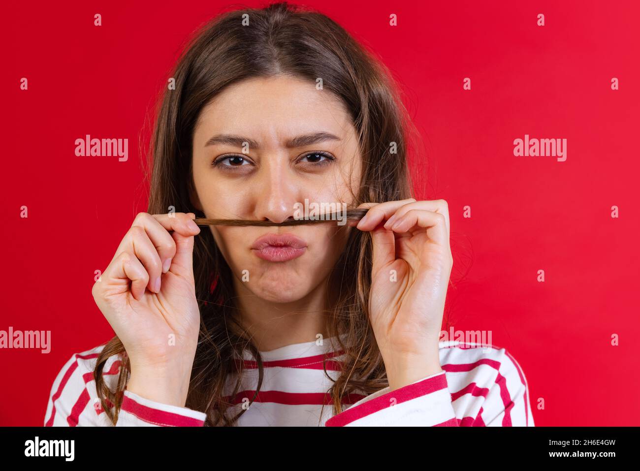 Emotional young beautiful girl in sweater and jeans posing isolated on ...