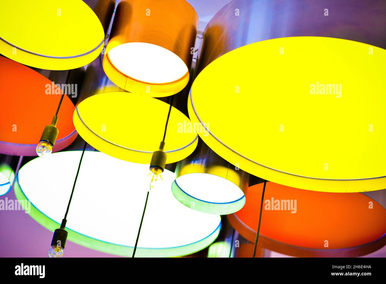 Close up of colorful circular decoration boards in the ceil, lamps ...