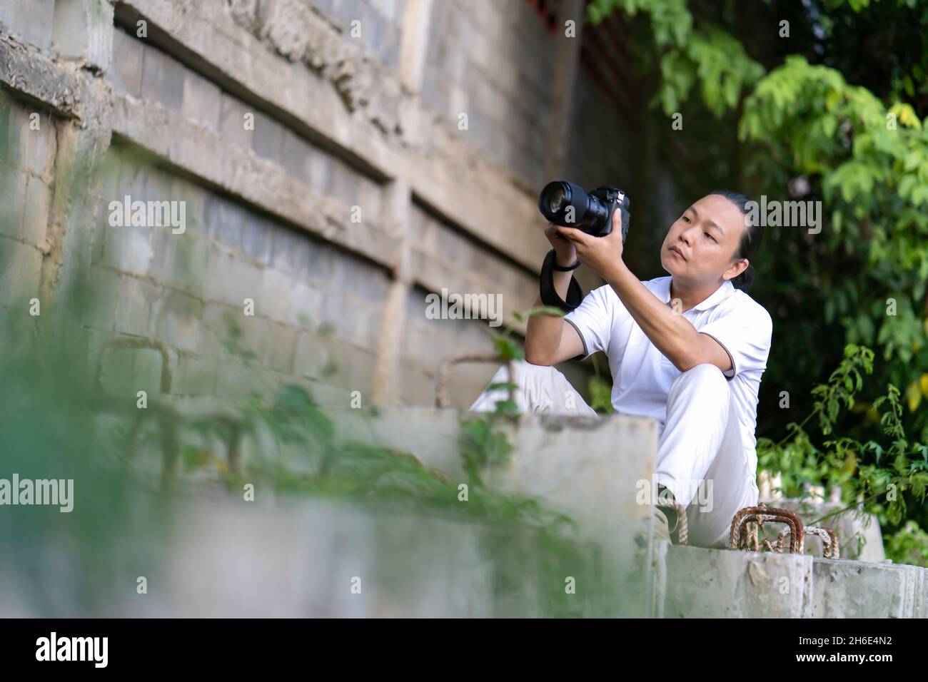 Professional Asian Chinese - Thai Camera man posture and focus in ...
