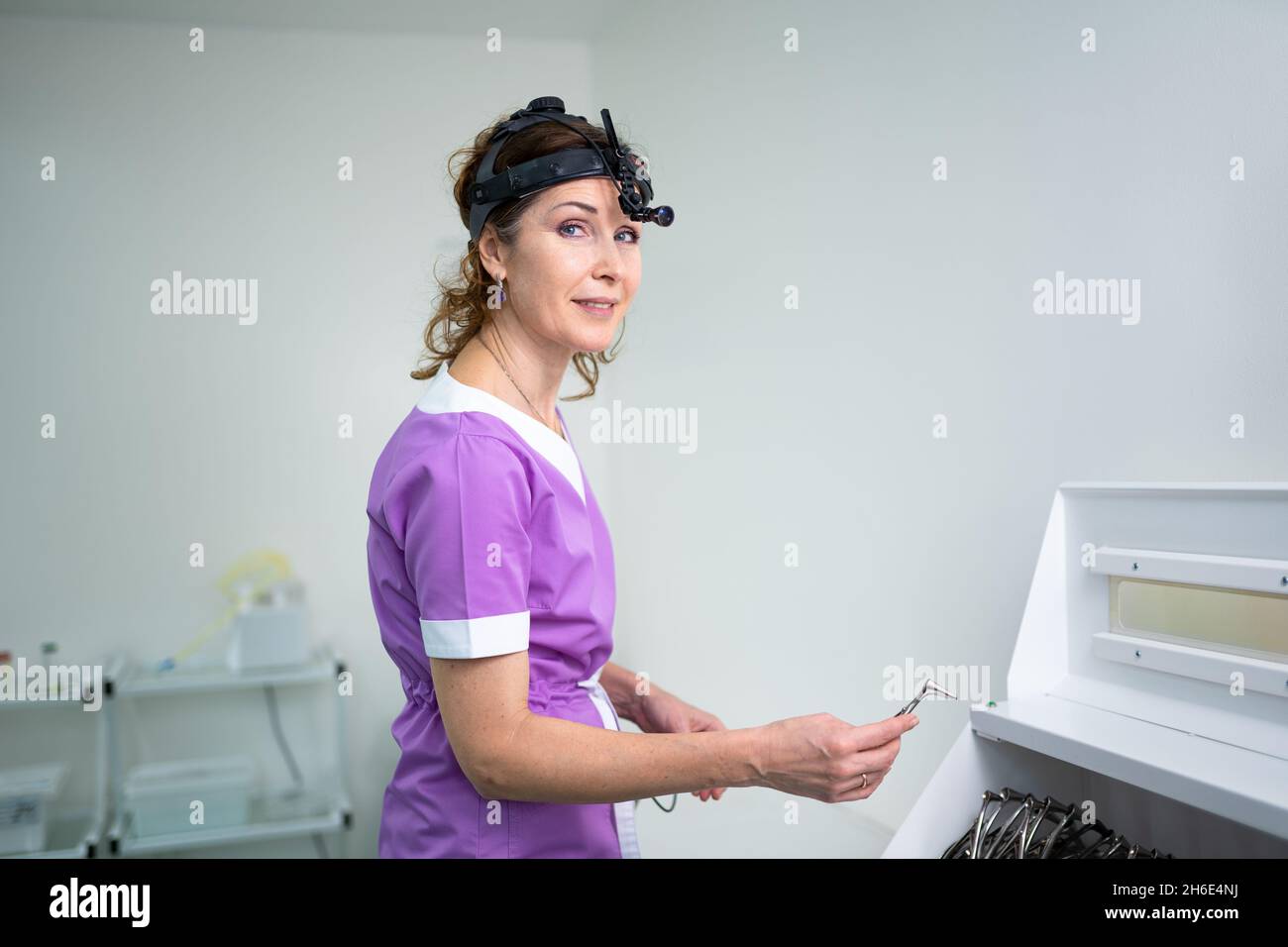 Professional otolaryngologist in modern clinic. Portrait of woman ...