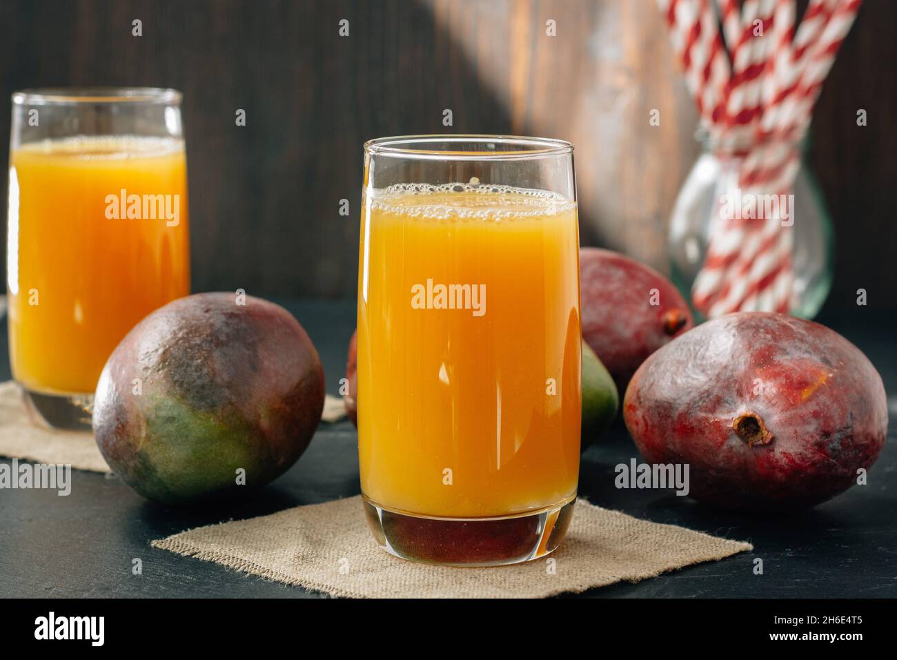 Mango juice in the glass, fresh fruit drink Stock Photo - Alamy