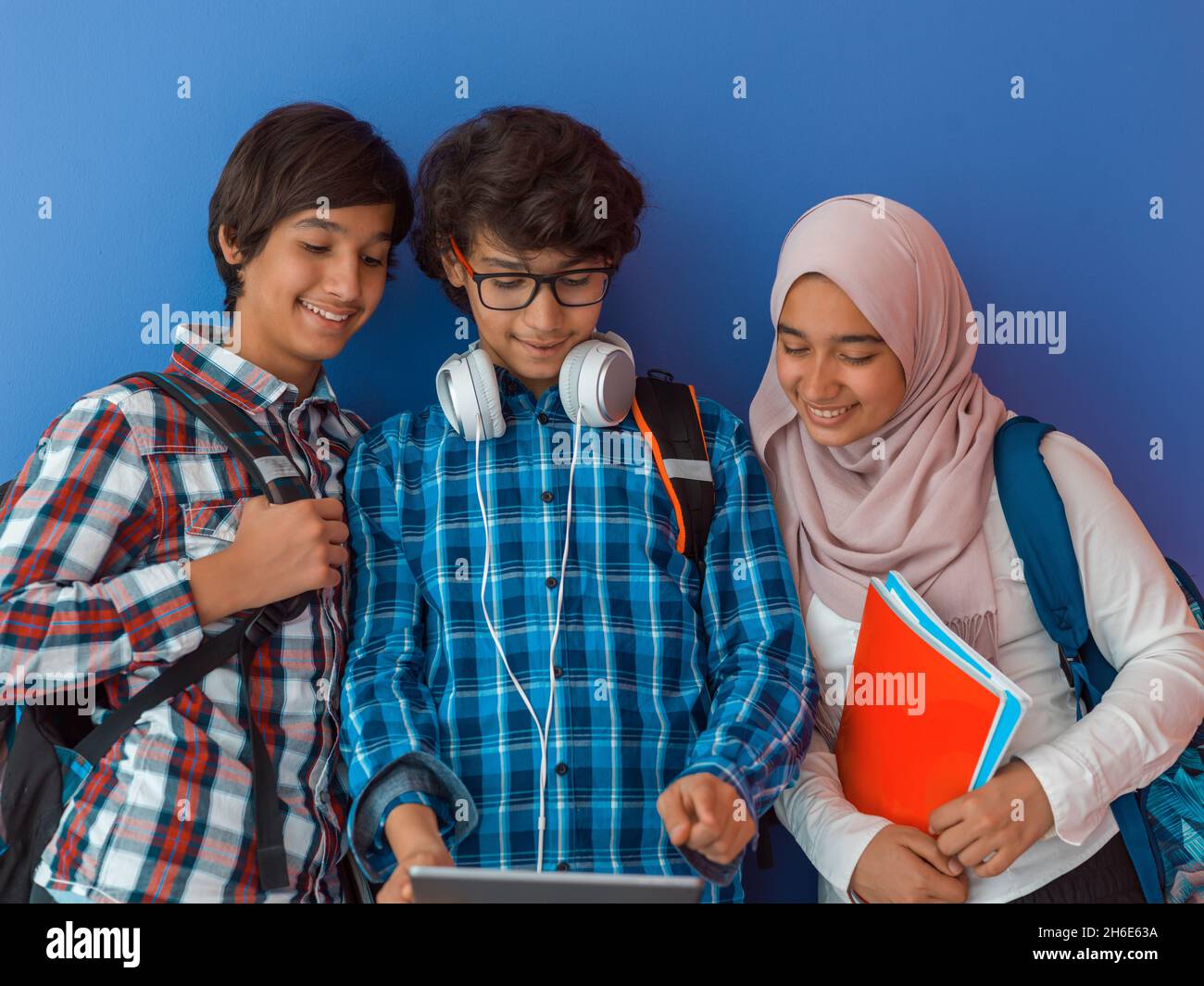 Modern arab teens use smartphone, tablet and latpop to study during ...