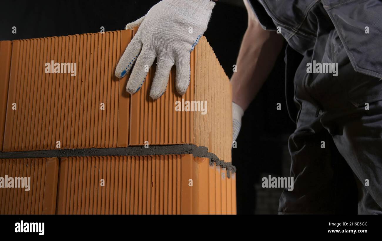 Craftsman man laying blocks hi-res stock photography and images - Alamy
