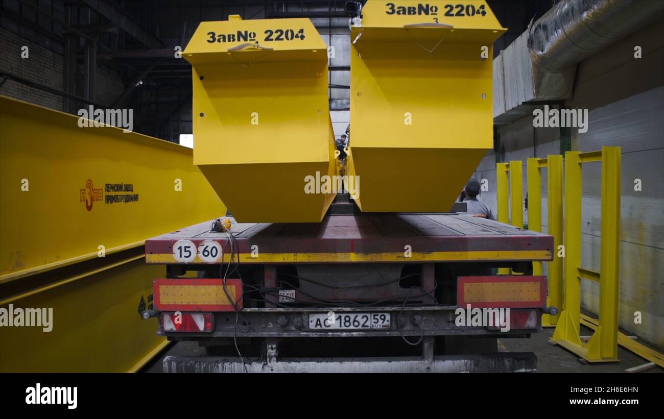 I-beam bridge crane. Clip. Warehouse with large yellow metal beams ...