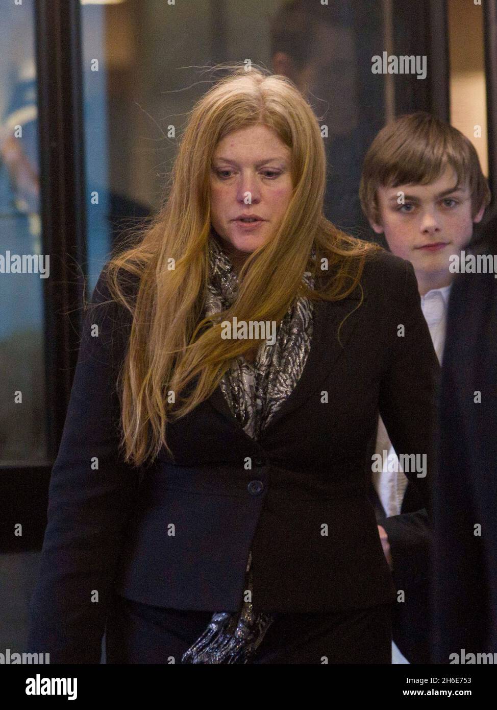 Edward Woollard's mother Tania Garwood leaves Southwark Crown Court ...