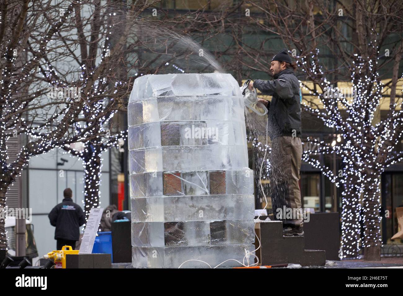 Teams of artists begin to create ice sculptures using chain saws at the ...